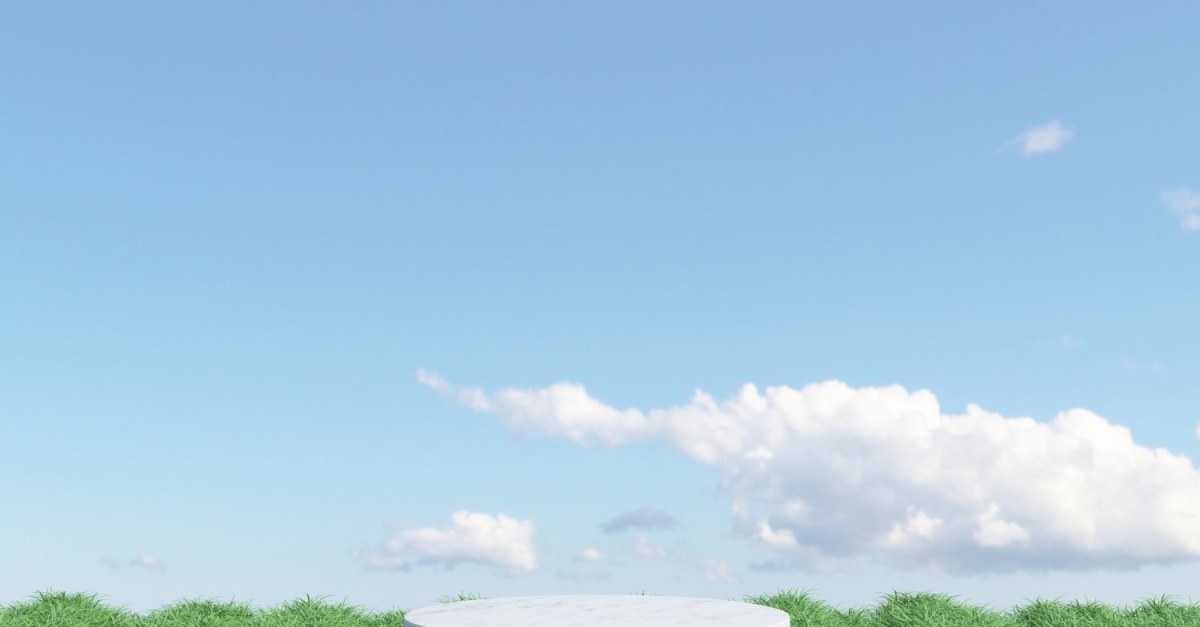 Marble podium backdrop with grass field & sky background