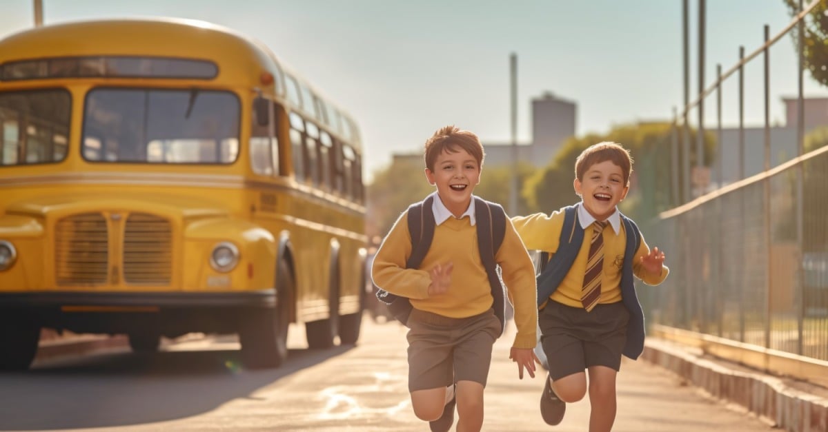 Kids running towards school, yellow bus behind the seen 295