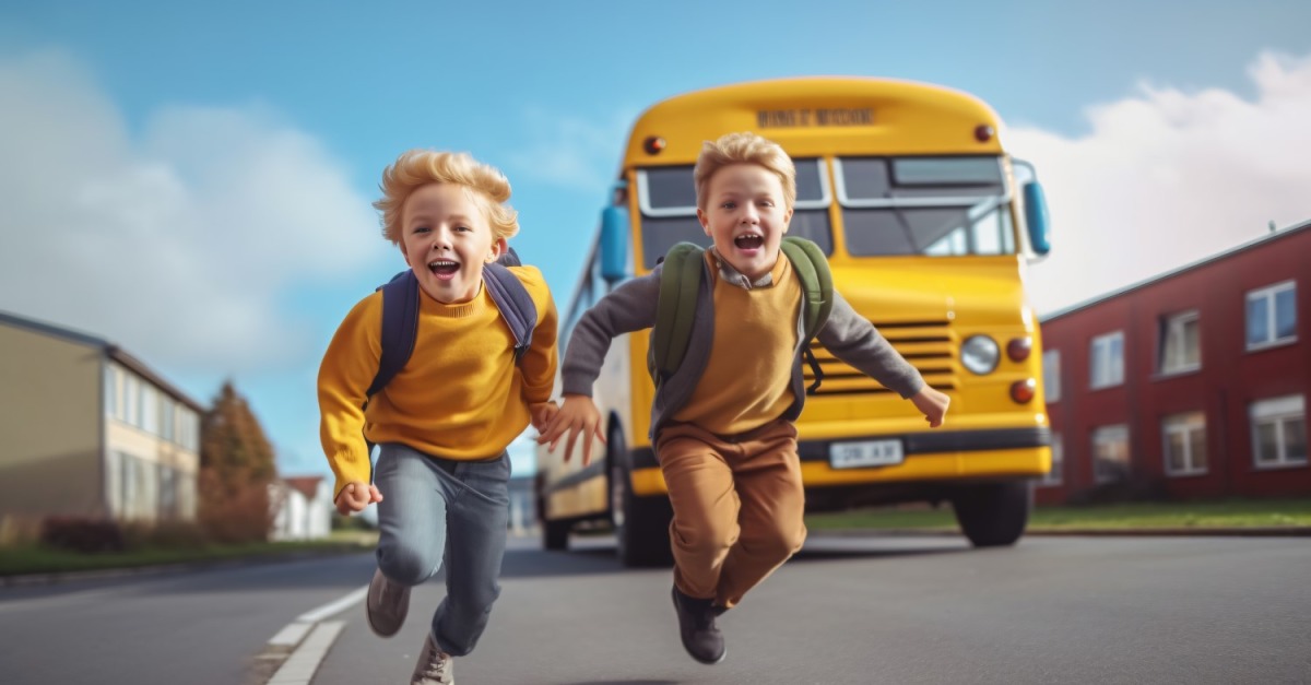 Kids running towards school, yellow bus behind the seen 298