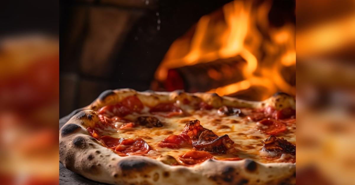 Pepperoni Pizza on a pizza stone in front of a fire 44